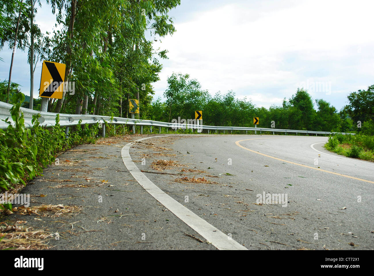 Empty curved road Stock Photo - Alamy
