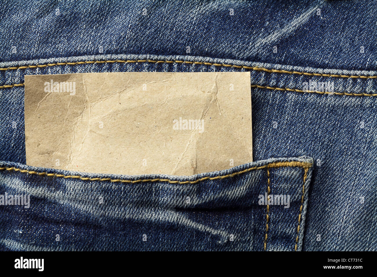 Jeans trousers with blank paper label Stock Photo - Alamy