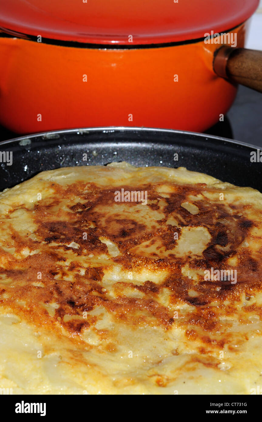 Homemade Spanish tortilla in a traditional tortilla pan, Andalusia ...