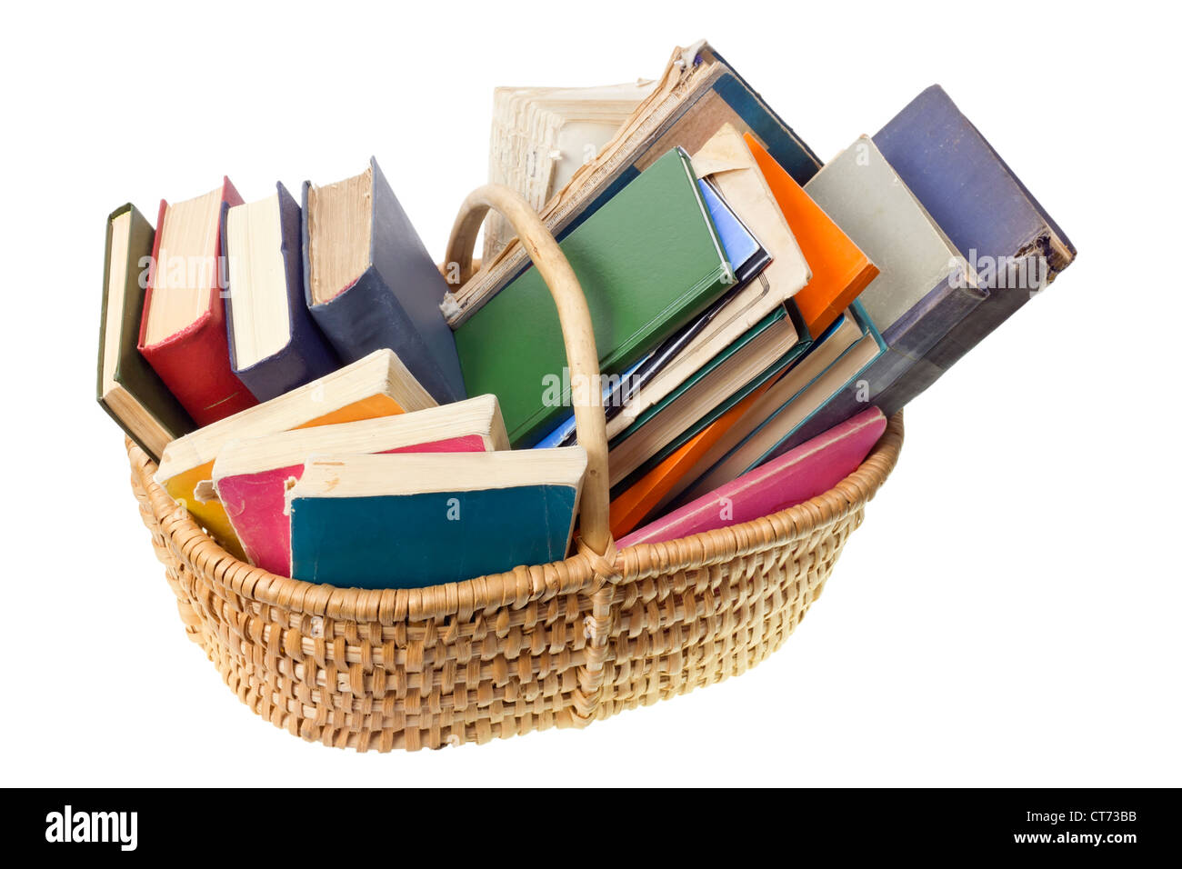 Old worn ragged books are in the basket isolated. Books on the garbage ...