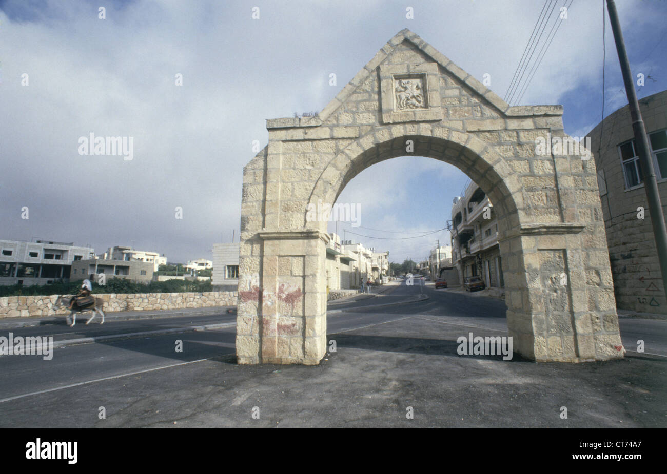 Photograph of an ancient gate in the modern town of El Hader in Judea ...