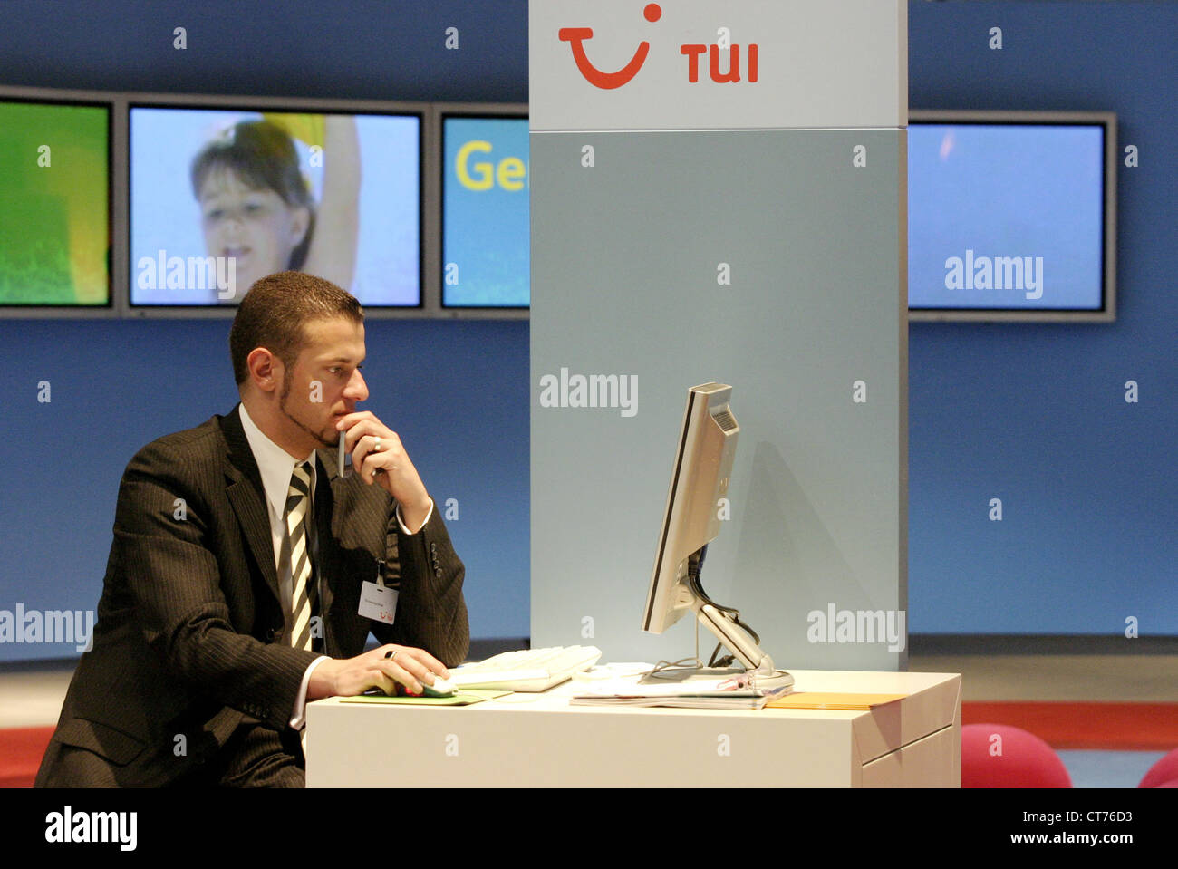 ITB Berlin, TUI employees at a computer Stock Photo - Alamy