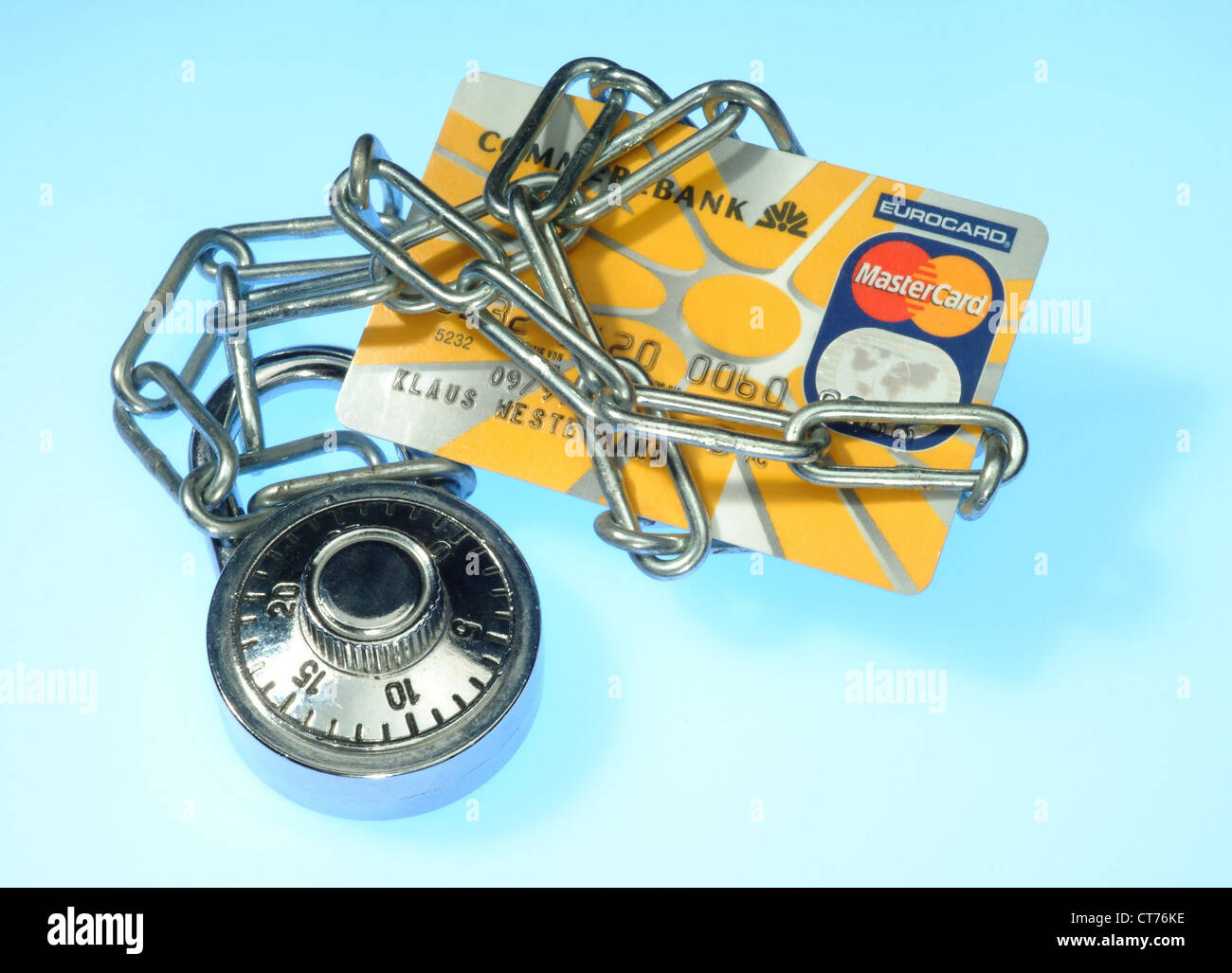 A credit card wrapped in a chain Stock Photo - Alamy