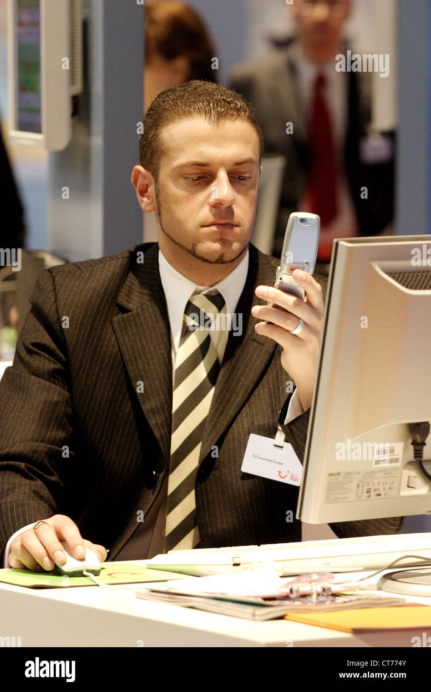 ITB Berlin, TUI employees at a computer Stock Photo - Alamy