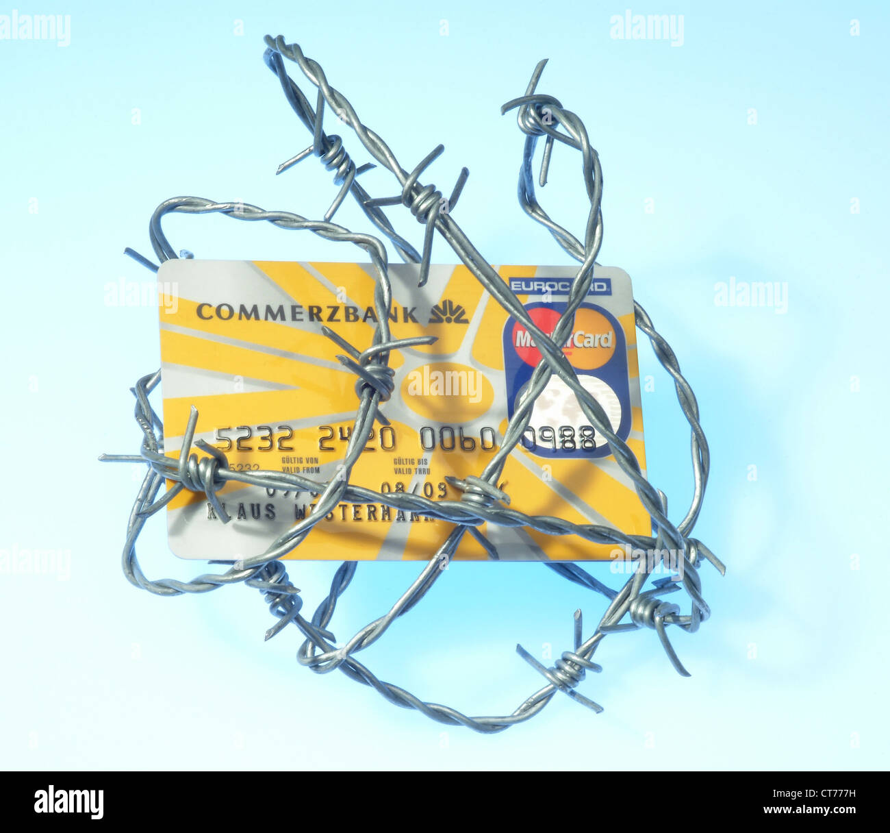 A credit card wrapped in barbed wire Stock Photo - Alamy