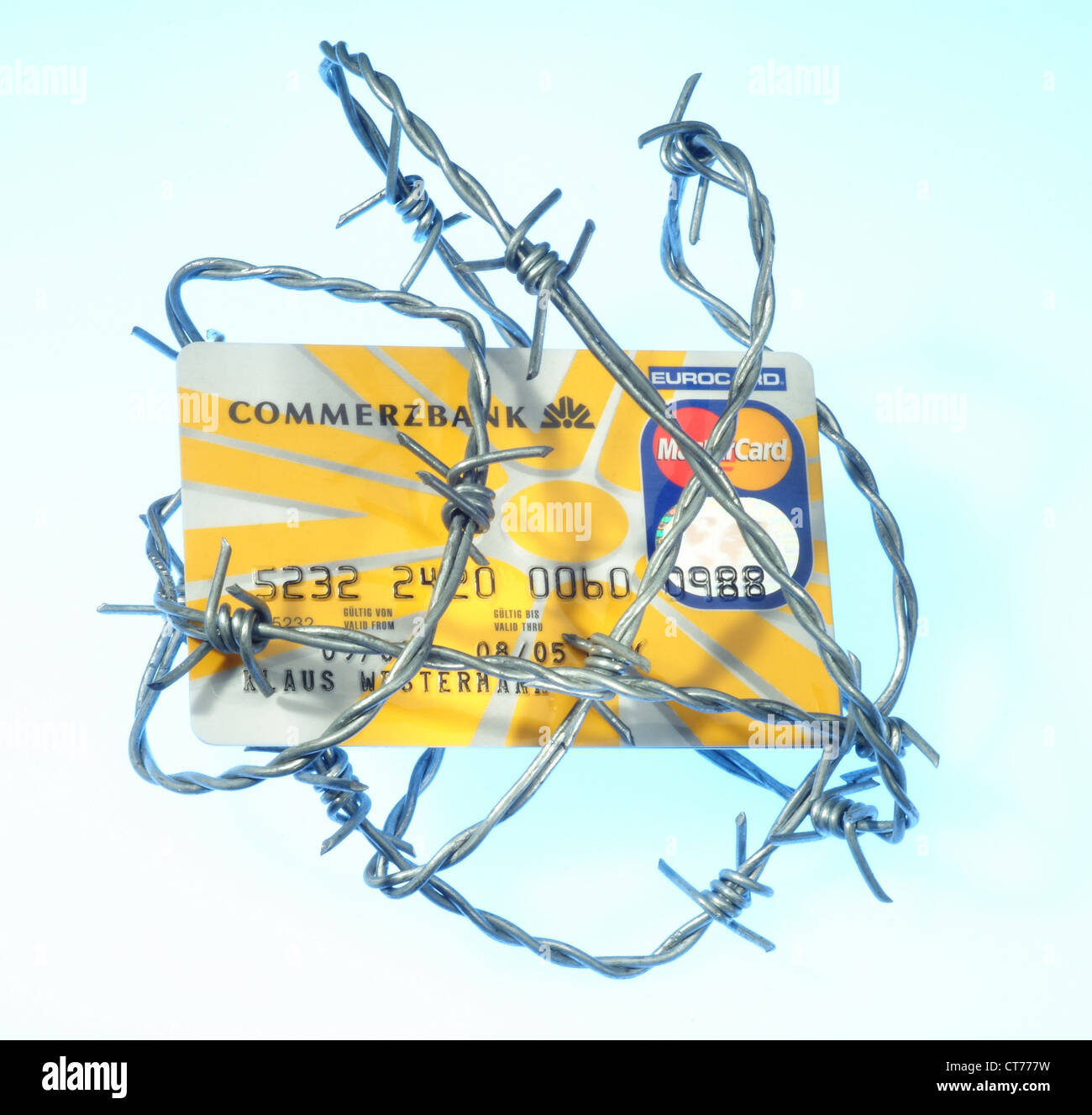 A credit card wrapped in barbed wire Stock Photo - Alamy