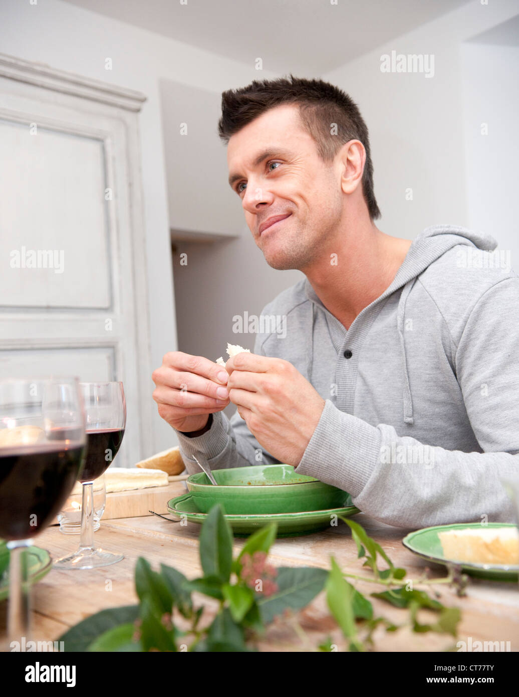 portrait young man eating bread Stock Photo - Alamy