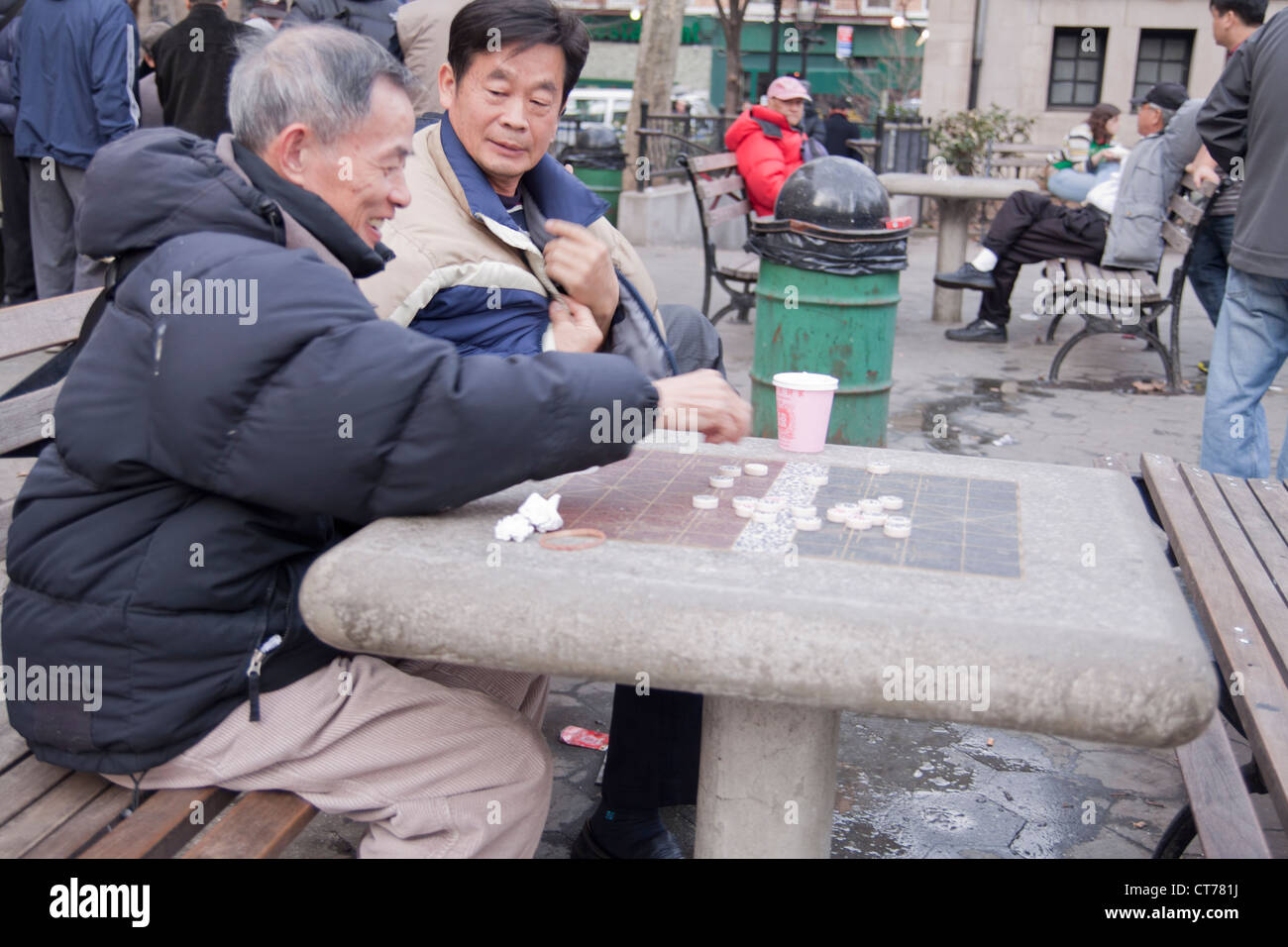 Two Japanese men playing a street board game in Osaka, Japan Stock ...