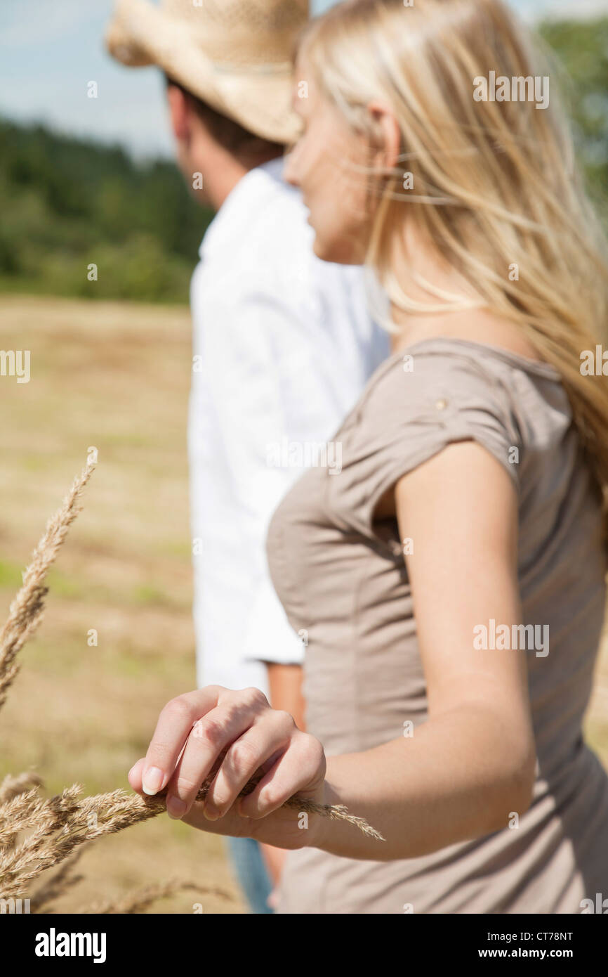 Man walking through field touching hi-res stock photography and images ...