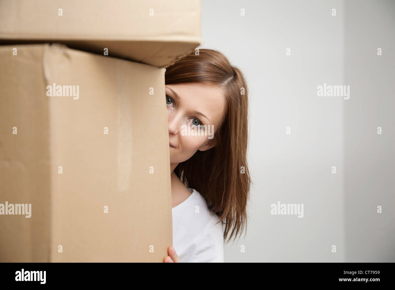 People hiding in boxes hi-res stock photography and images - Alamy