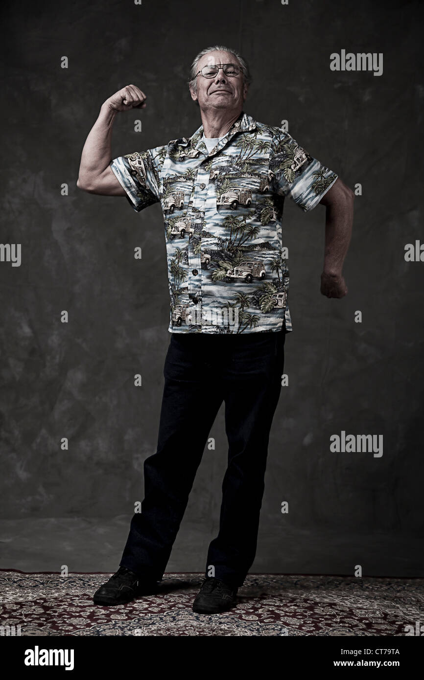 Senior flexing muscles hi-res stock photography and images - Alamy