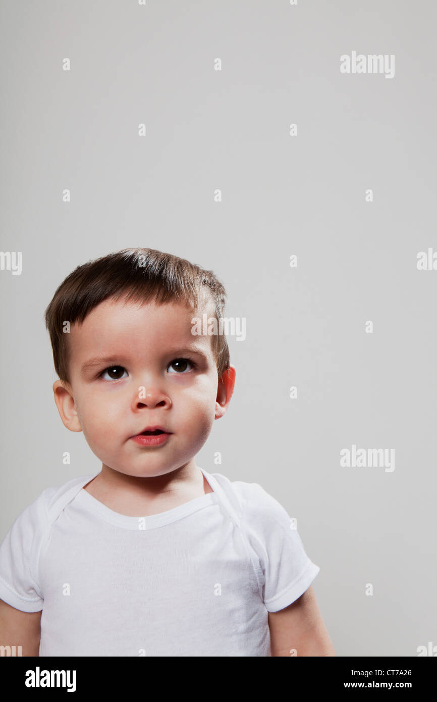 Baby boy looking up Stock Photo - Alamy