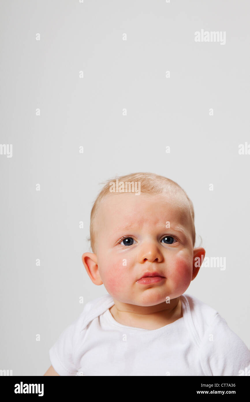 Confused looking baby boy Stock Photo - Alamy