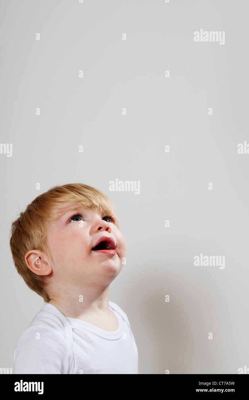 Boy looking up Stock Photo - Alamy