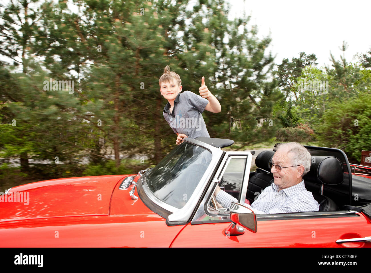 Senior man driving sports car hi-res stock photography and images - Alamy