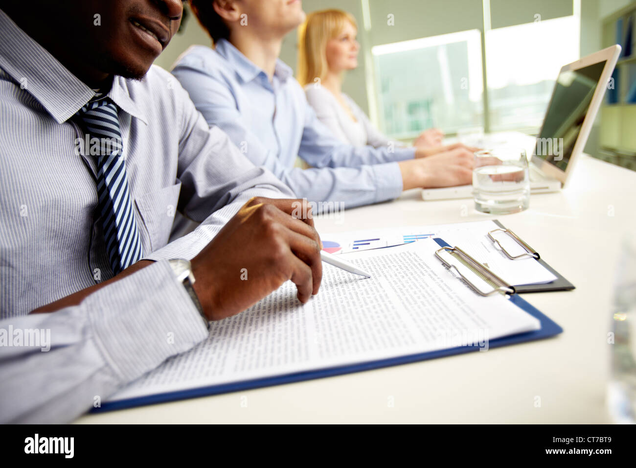 Multicultural business team on their usual working day at office Stock ...