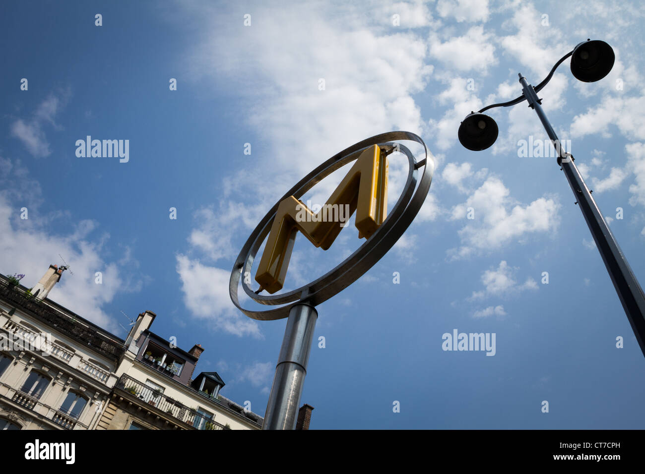 Looking up at a Paris Metro sign and the sky Stock Photo - Alamy