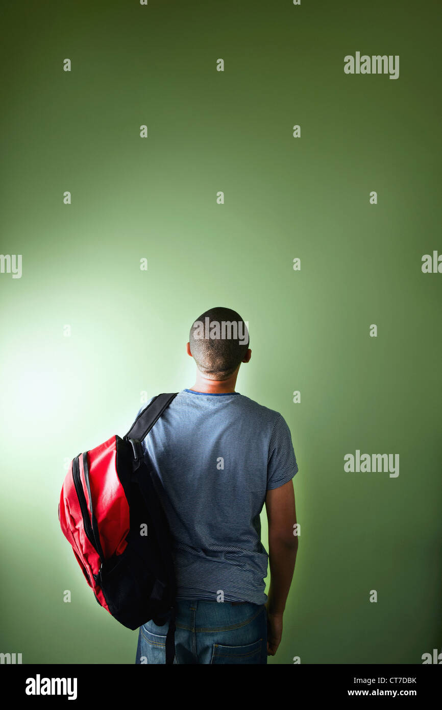 Schoolboy with backpack, rear view Stock Photo - Alamy