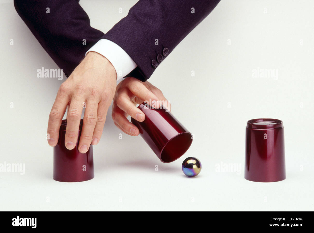 Cup and ball trick hi-res stock photography and images - Alamy