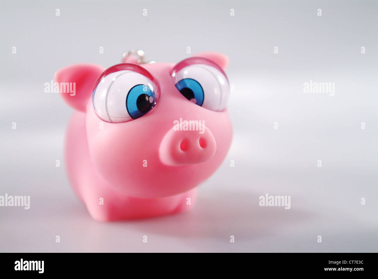 A squinting, pink plastic pig Stock Photo - Alamy