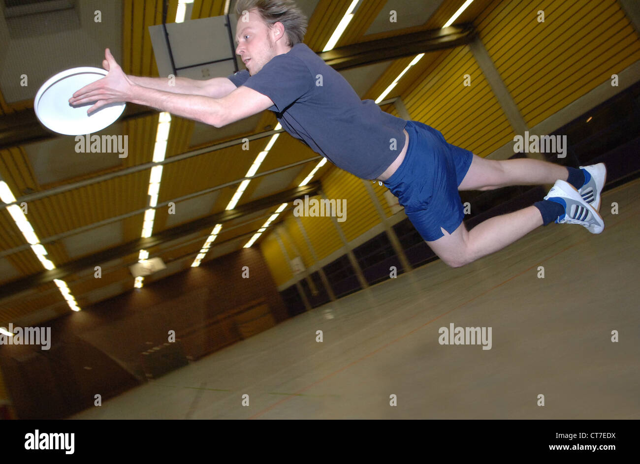 Young man playing frisbee at Sporthalle, Berlin Stock Photo - Alamy