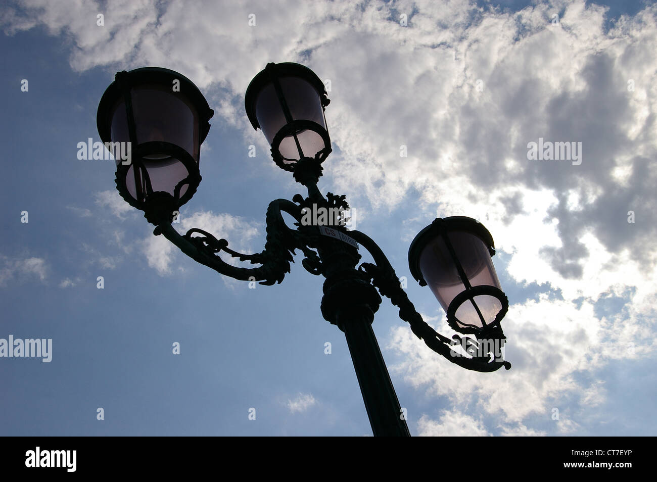 Traditional street lights in Venice, Italy. On a slightly cloudy but ...