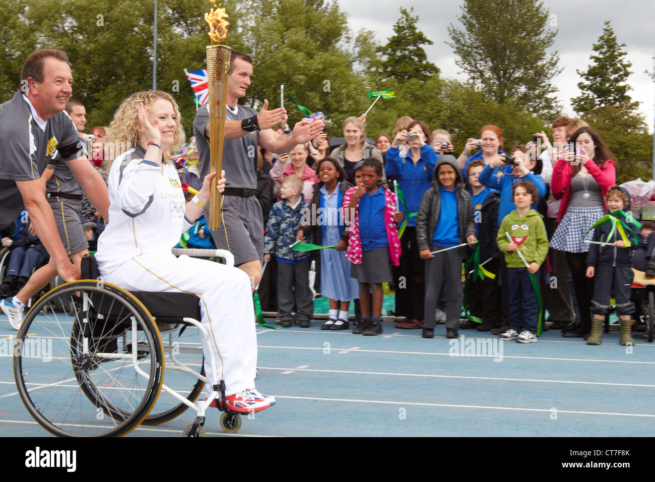 Gemma Collis enters Stoke Mandeville Stadium carrying the Olympic Torch ...