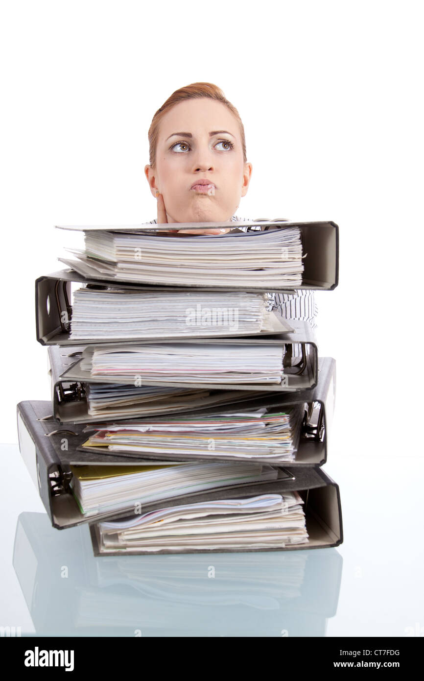 business woman in office looks at unbelievable folder stack isolated on ...