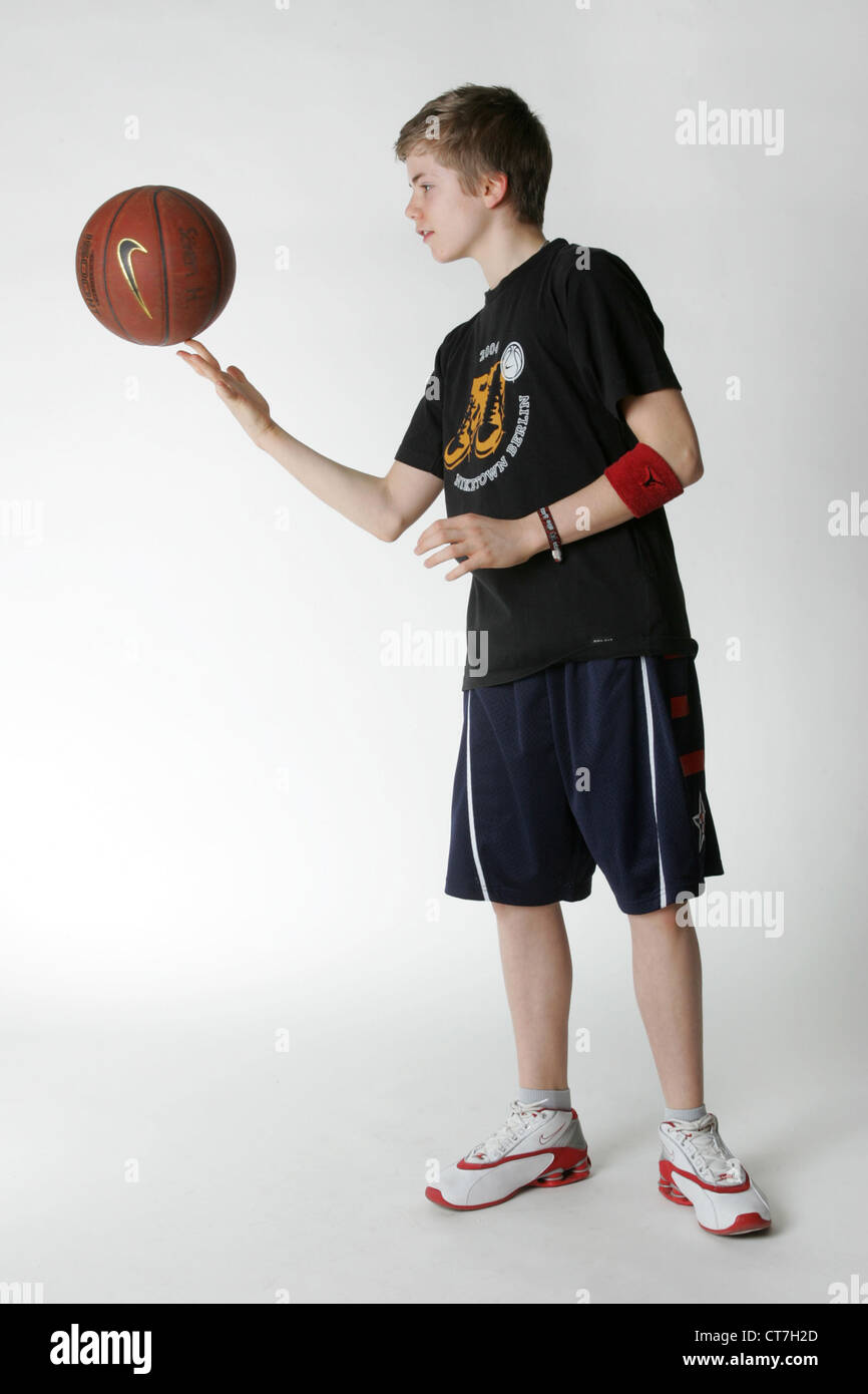 A boy juggling with a basketball Stock Photo - Alamy