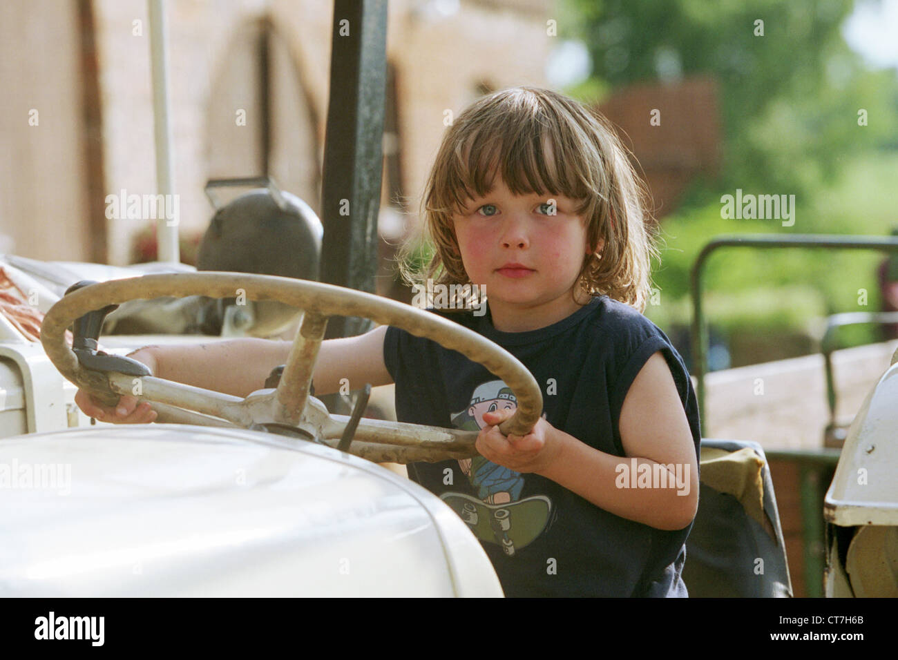 A child on a tractor Stock Photo - Alamy