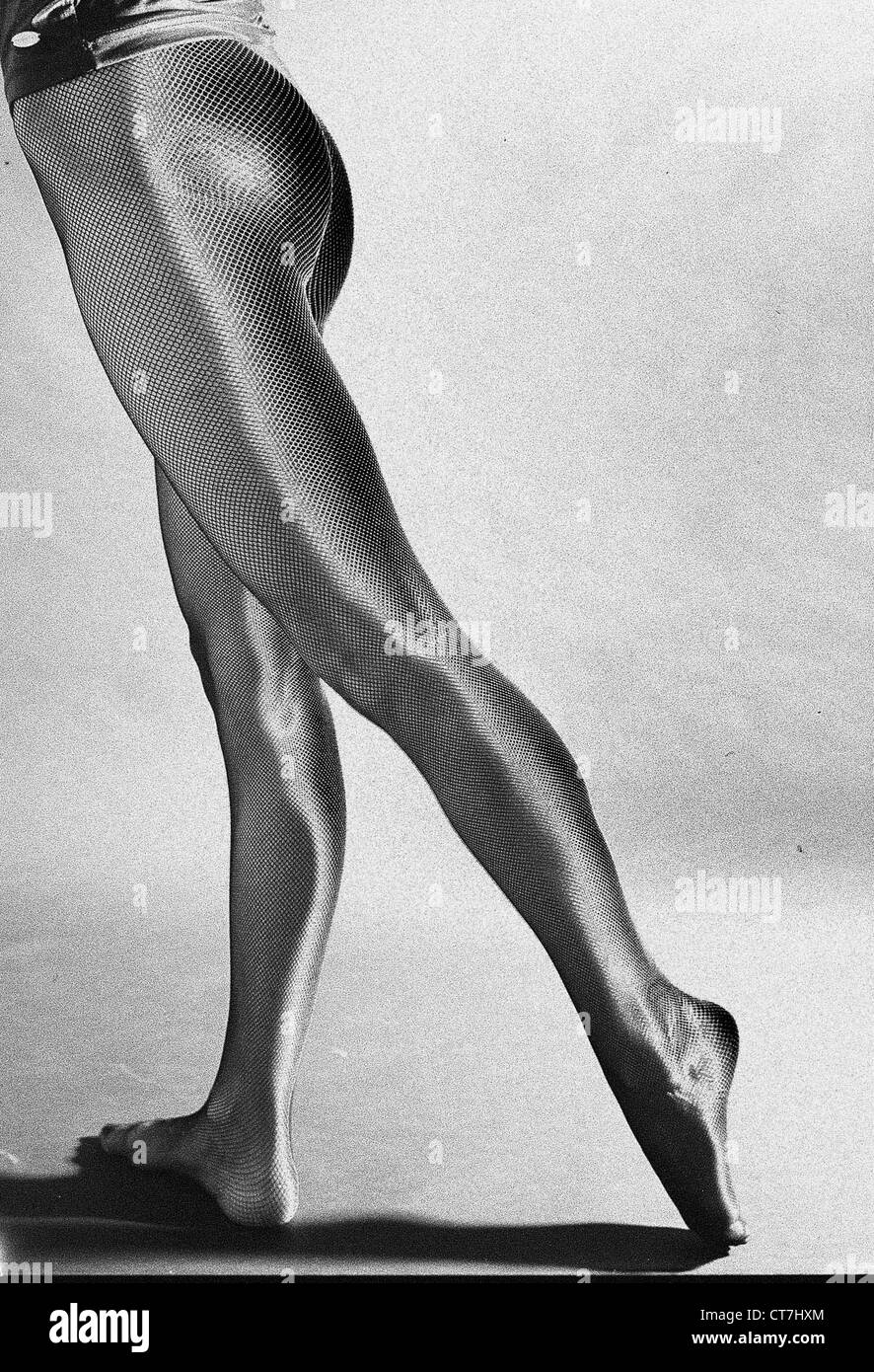 With legs stretched Black and White Stock Photos & Images - Alamy