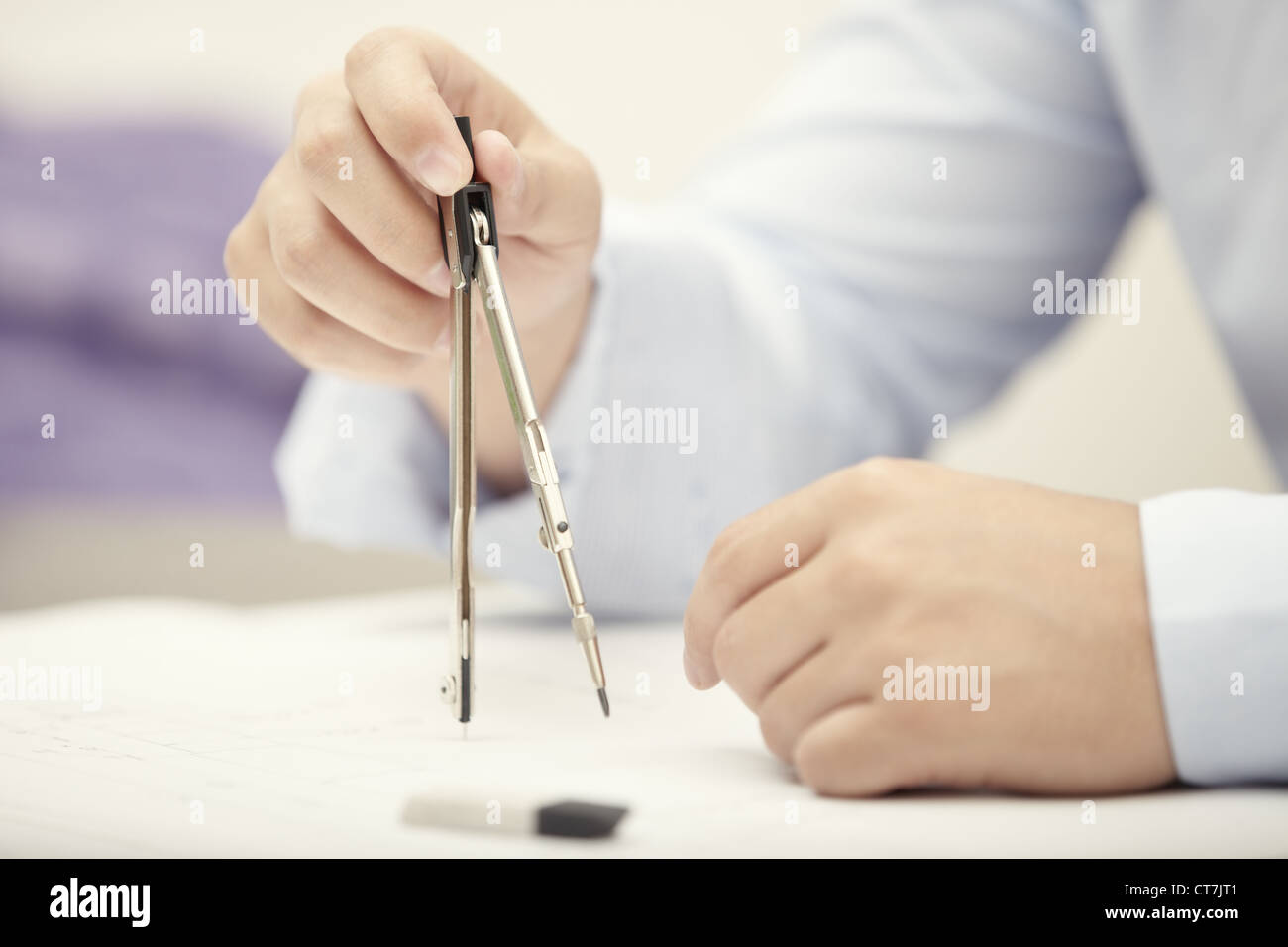 Hands of engineer working with compasses Stock Photo - Alamy
