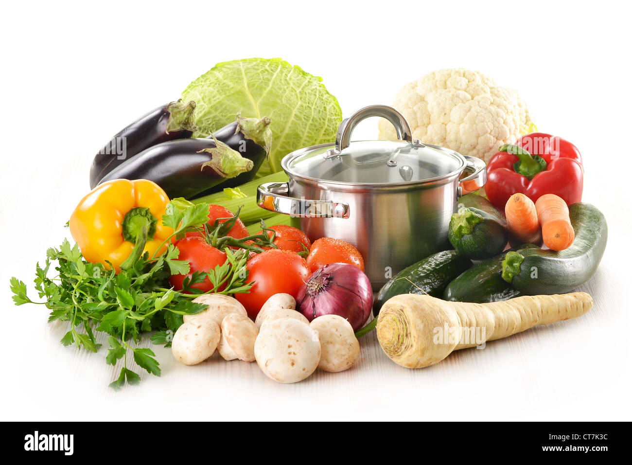 Composition with pot and fresh vegetables isolated on white Stock Photo ...