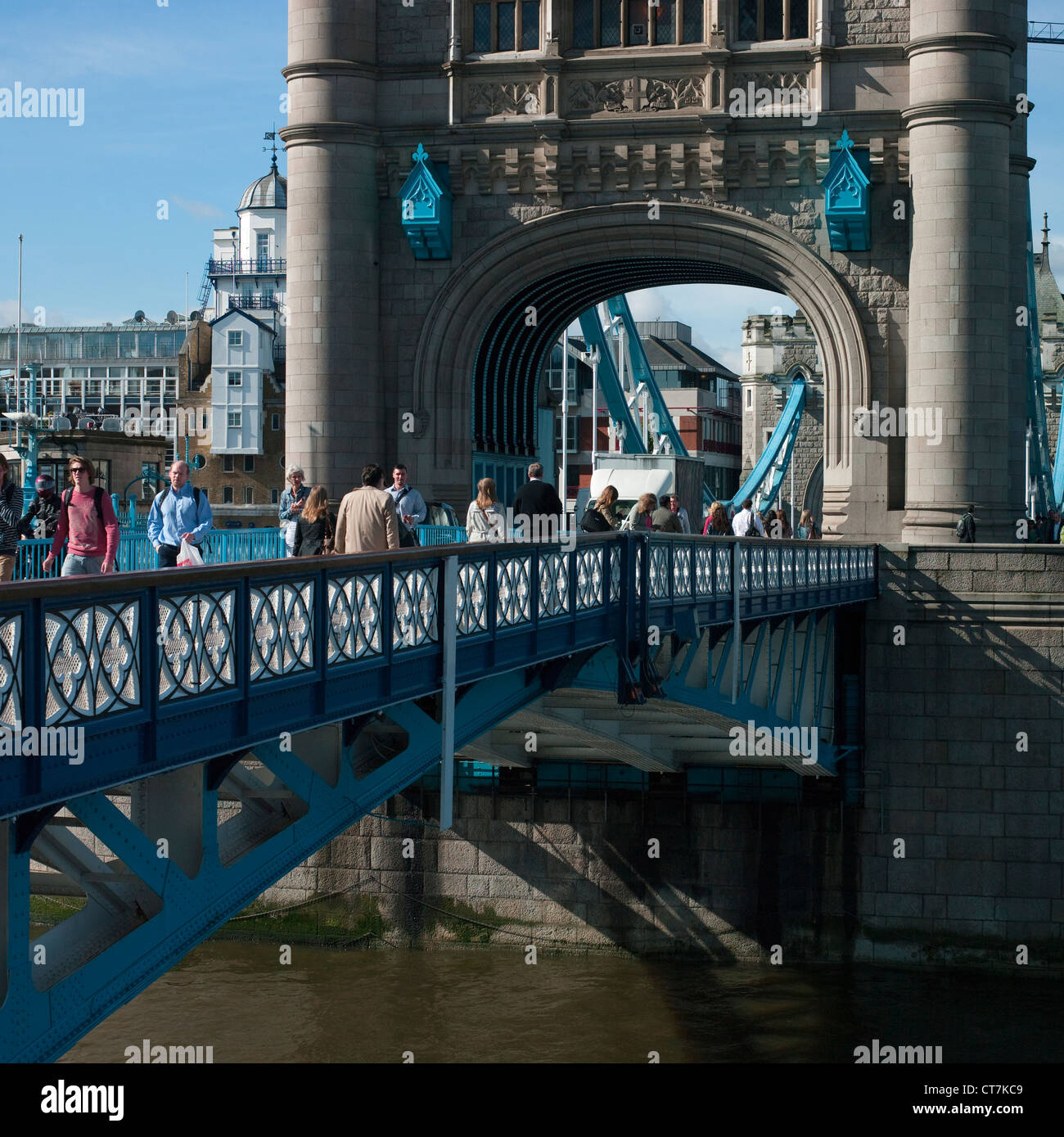 Pedestrians crossing Tower Bridge in London Stock Photo - Alamy