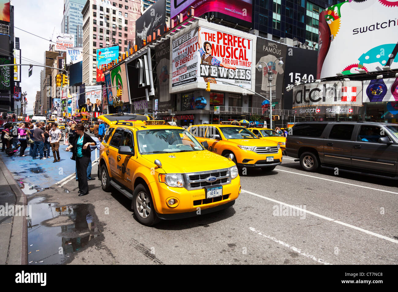 The iconic yellow taxi taxis cab in Times Square, New York city USA ...