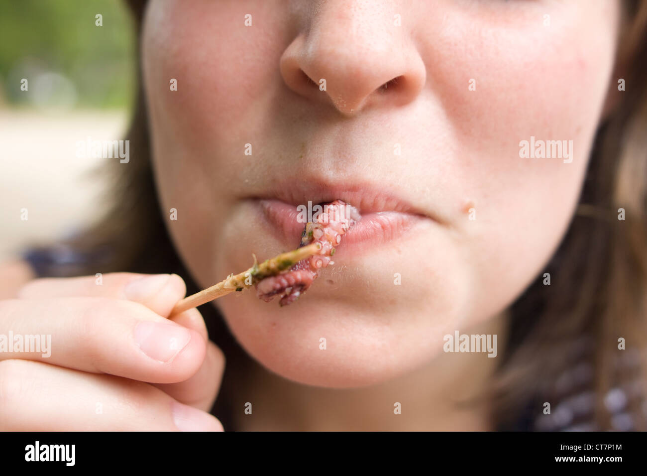 Japan girl eat octopus hi-res stock photography and images - Alamy