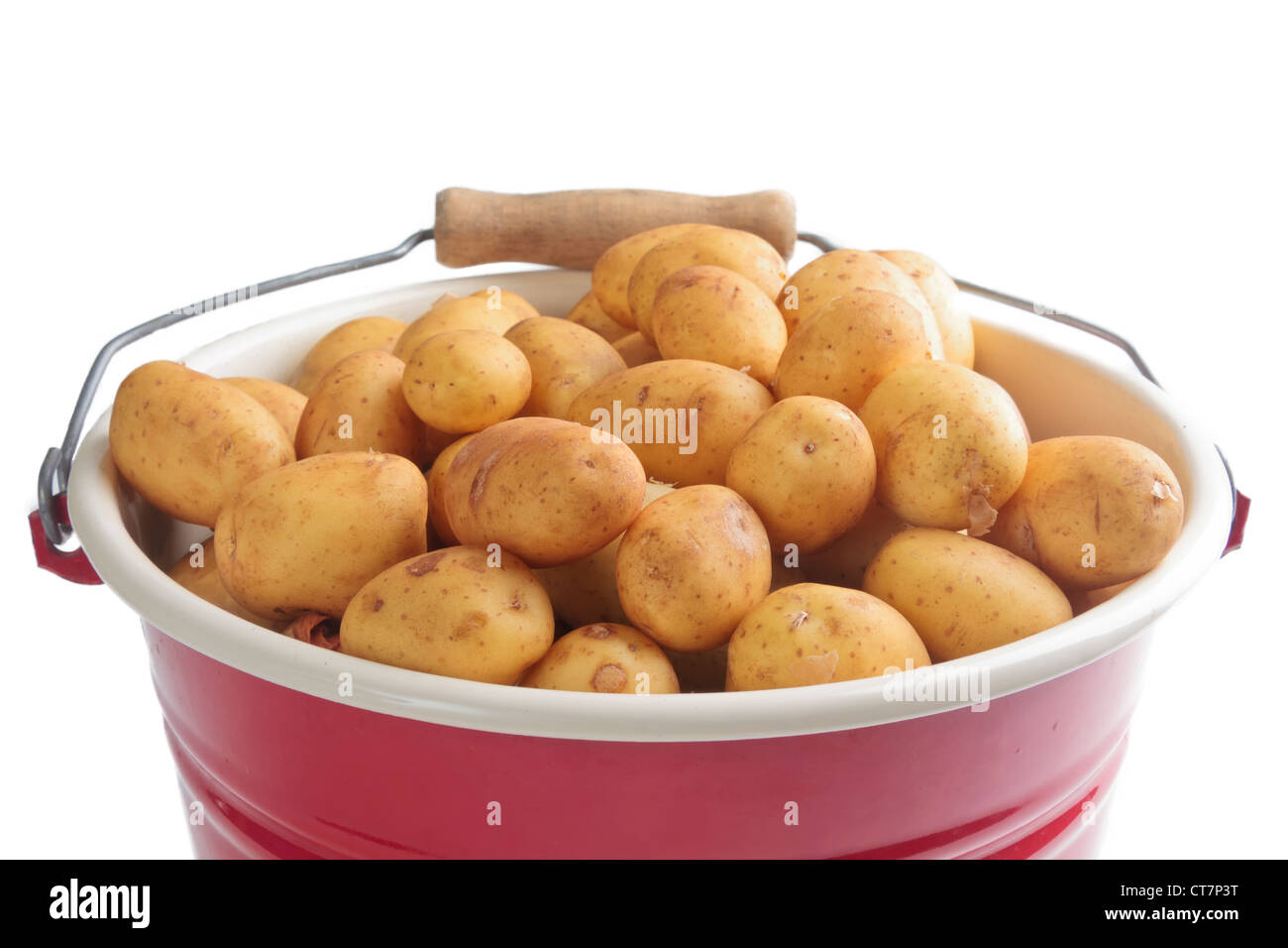 Red bucket containing new potatoes Stock Photo - Alamy