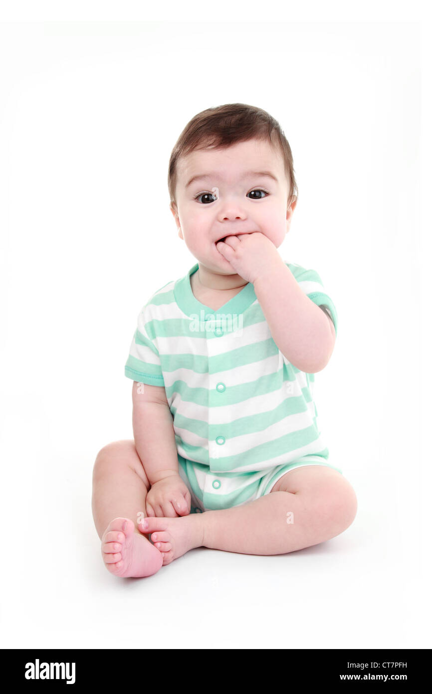 Baby boy biting his fingers Stock Photo - Alamy