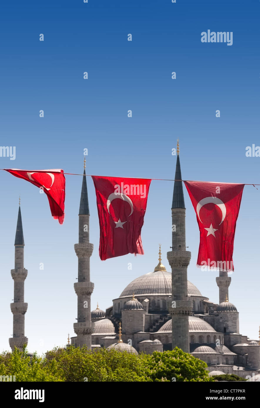Mosque behind turkish flags in blue sky Stock Photo - Alamy