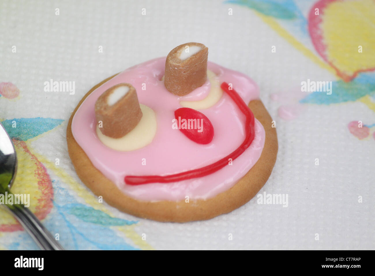 Smiley iced biscuit decorated at school fair Stock Photo - Alamy
