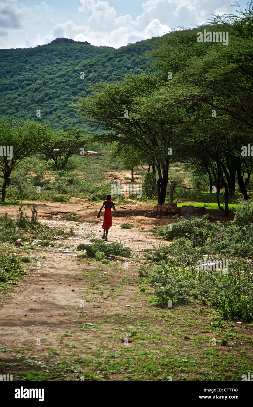 Little boy in the African landscape Stock Photo - Alamy