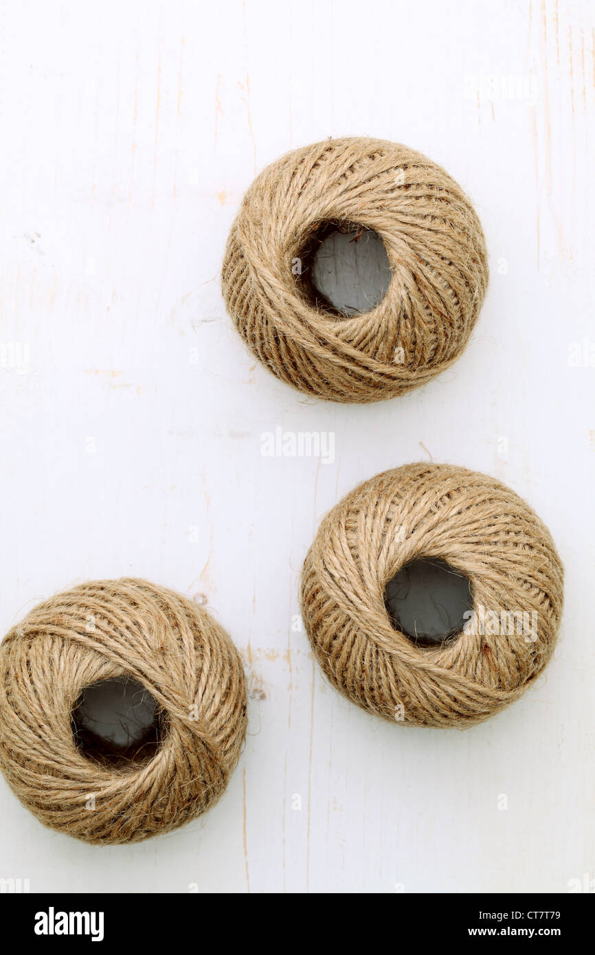 Clew of linen twine on white background Stock Photo - Alamy