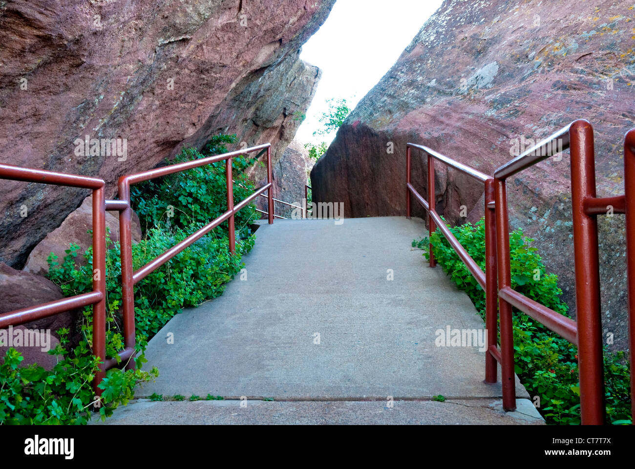 Hand rail and sidewalk lead to entrance Stock Photo - Alamy