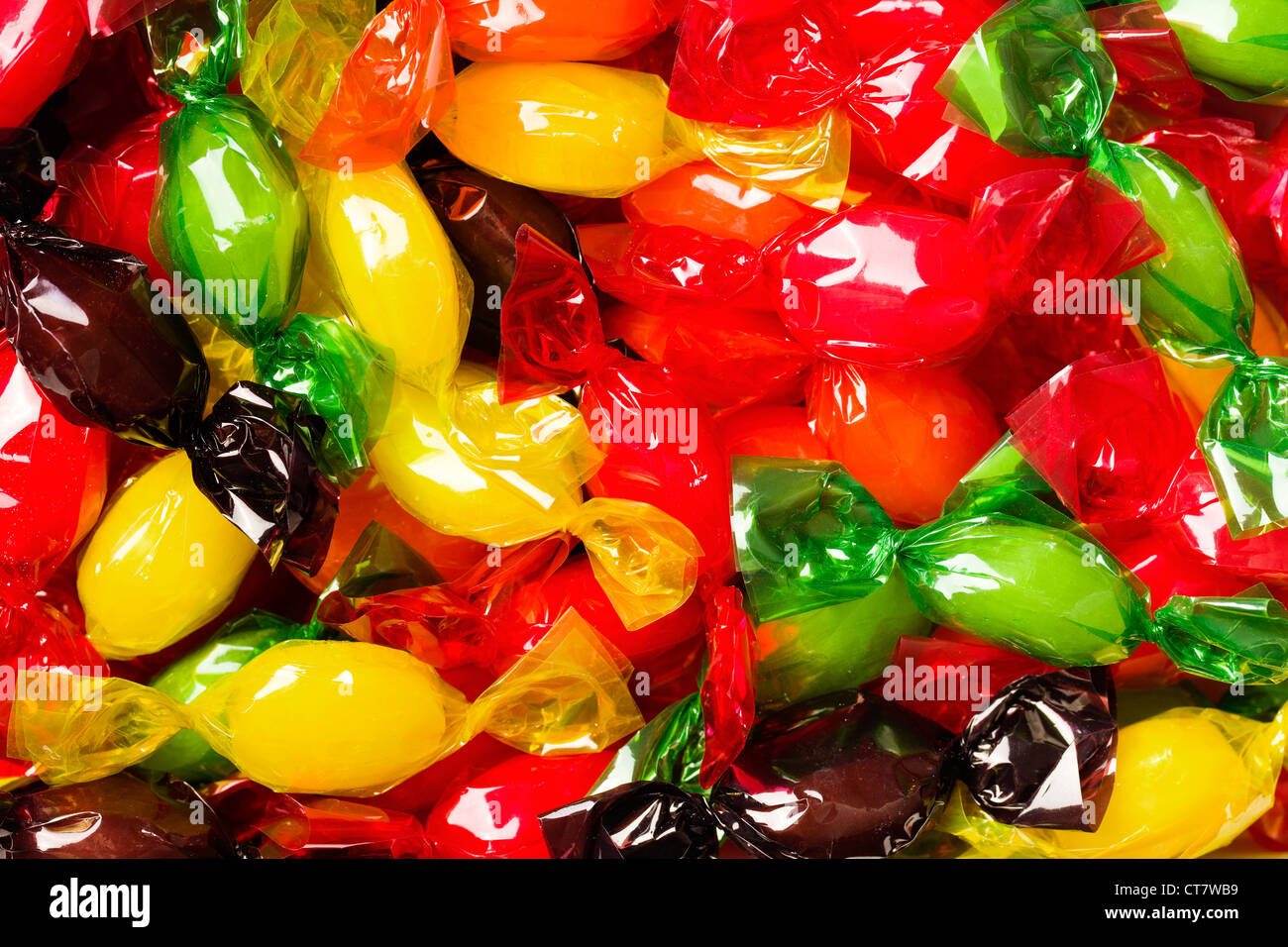 the colored candy wrapped in foil Stock Photo - Alamy