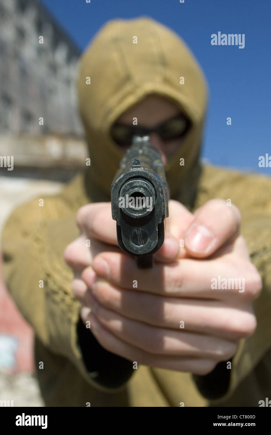 A teenager pulls a gun Stock Photo - Alamy