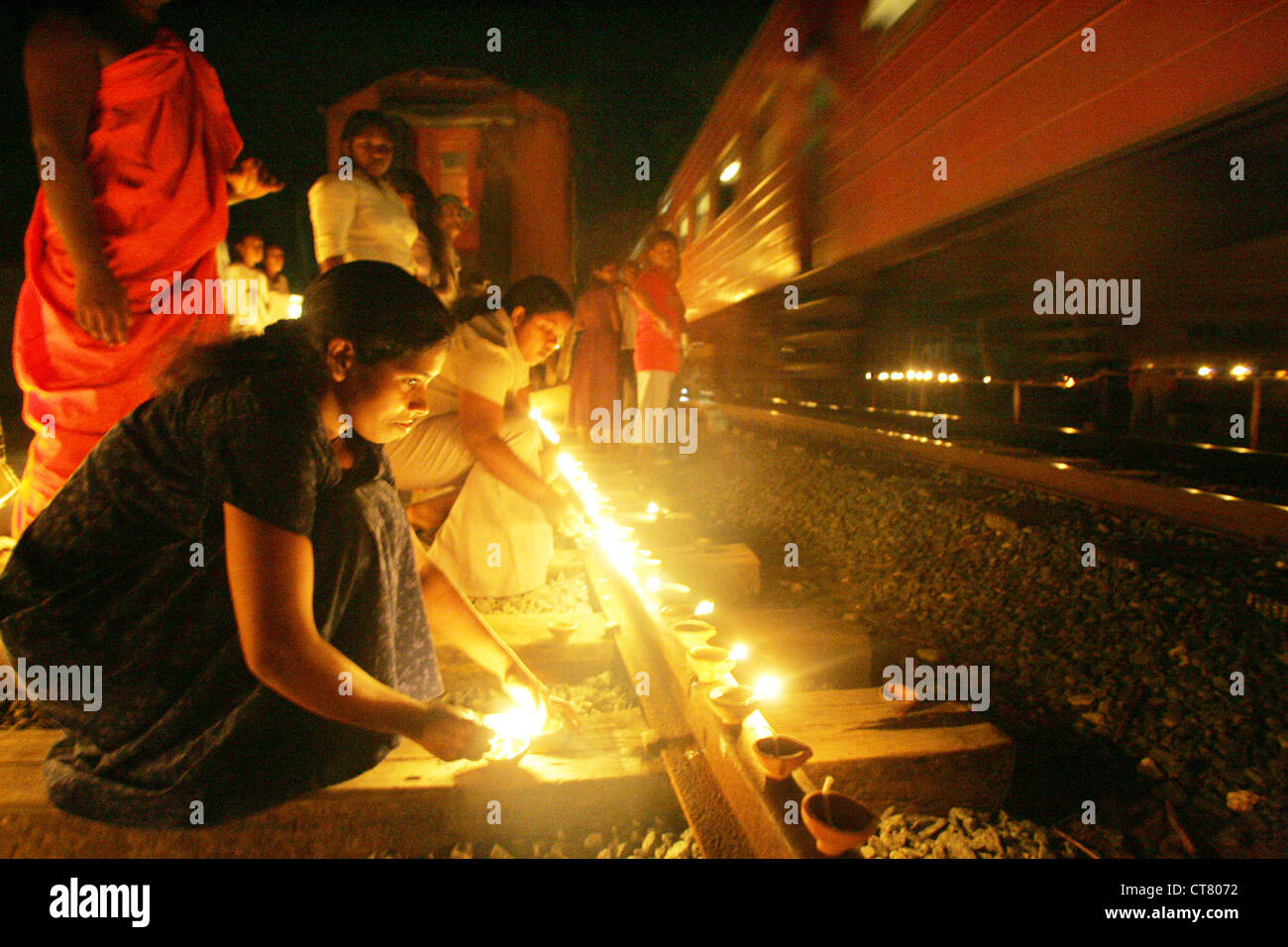 Igniting candles on train-wreck, Thelwatta Stock Photo - Alamy