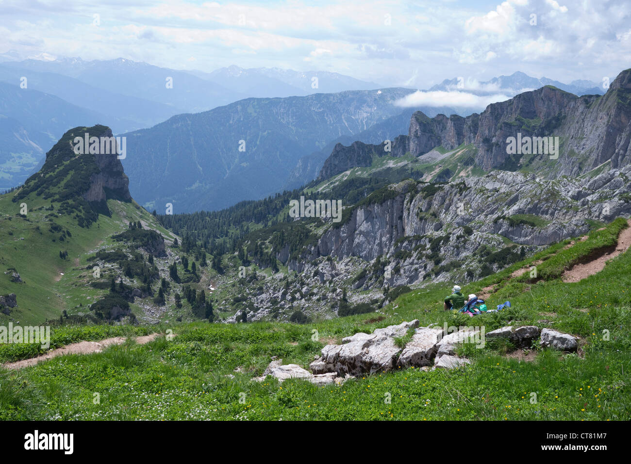 hikers resting on a meadow in the Rofan mountains, Austria Stock Photo ...