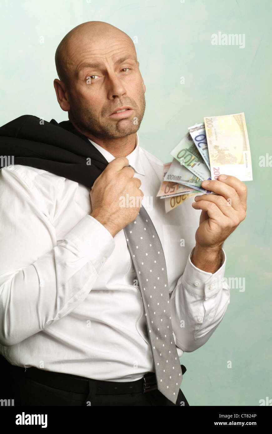 Arrogant man posing with euro notes Stock Photo - Alamy