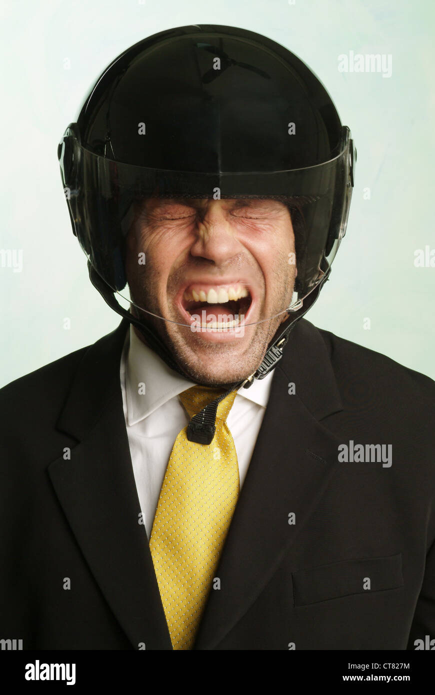 Man with helmet screams Stock Photo - Alamy