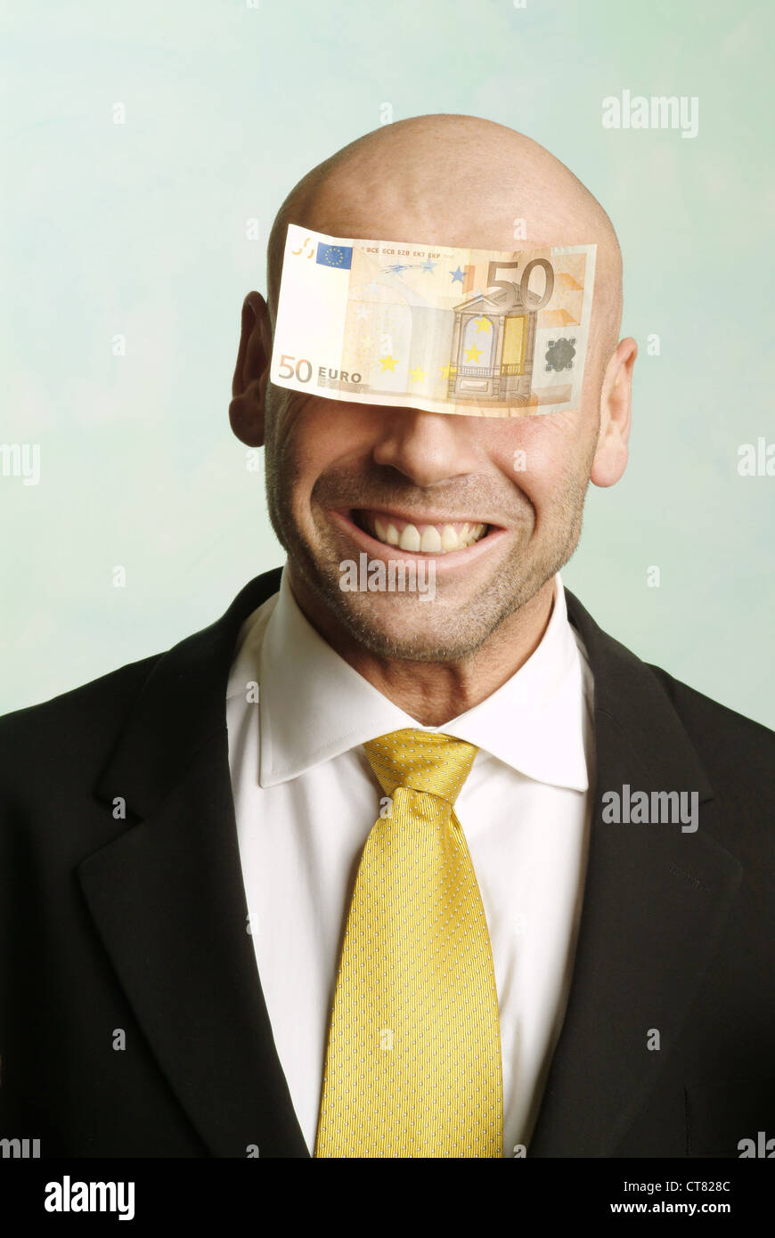 Man with money on his forehead Stock Photo - Alamy